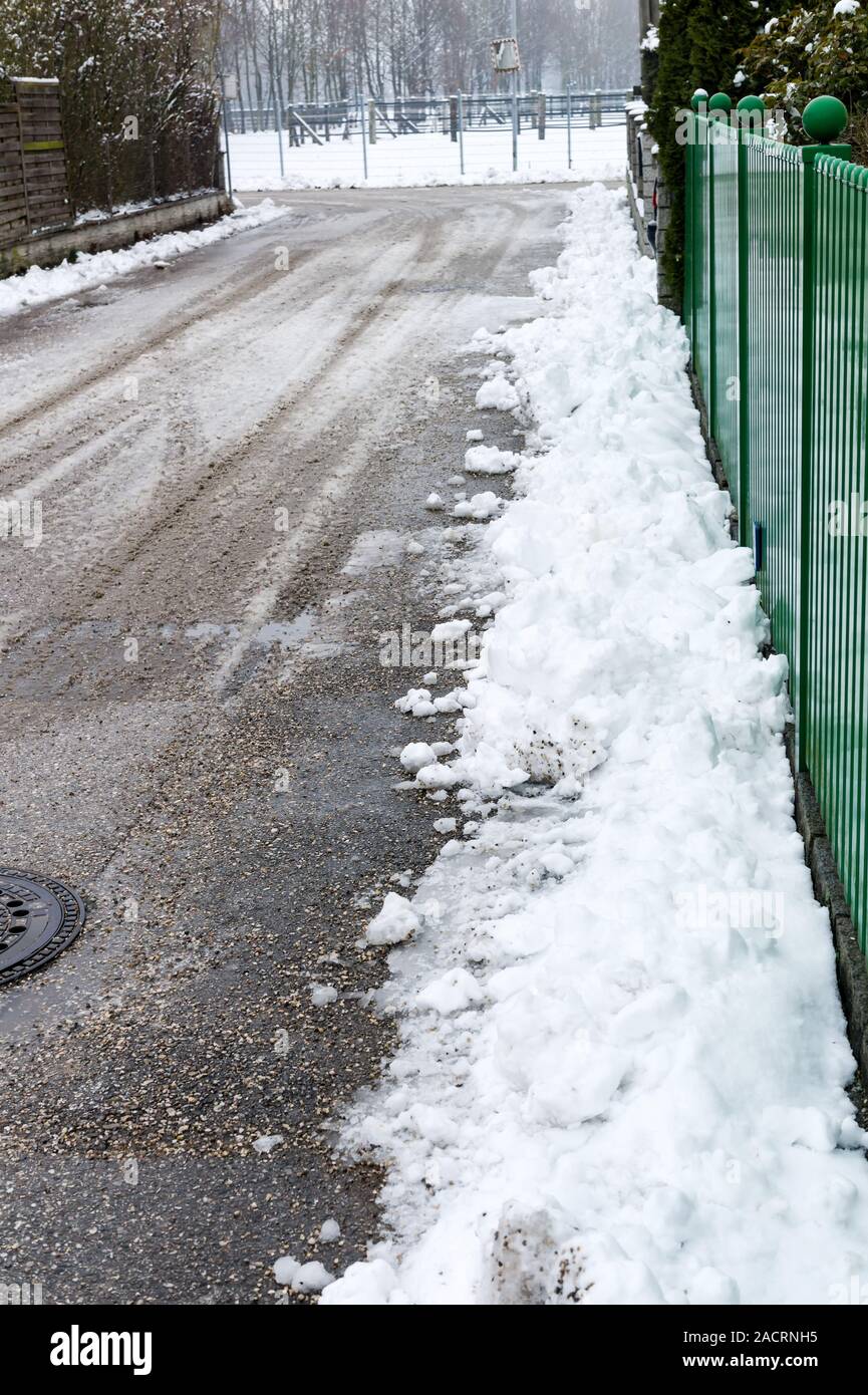 Snow on sidewalk Stock Photo - Alamy