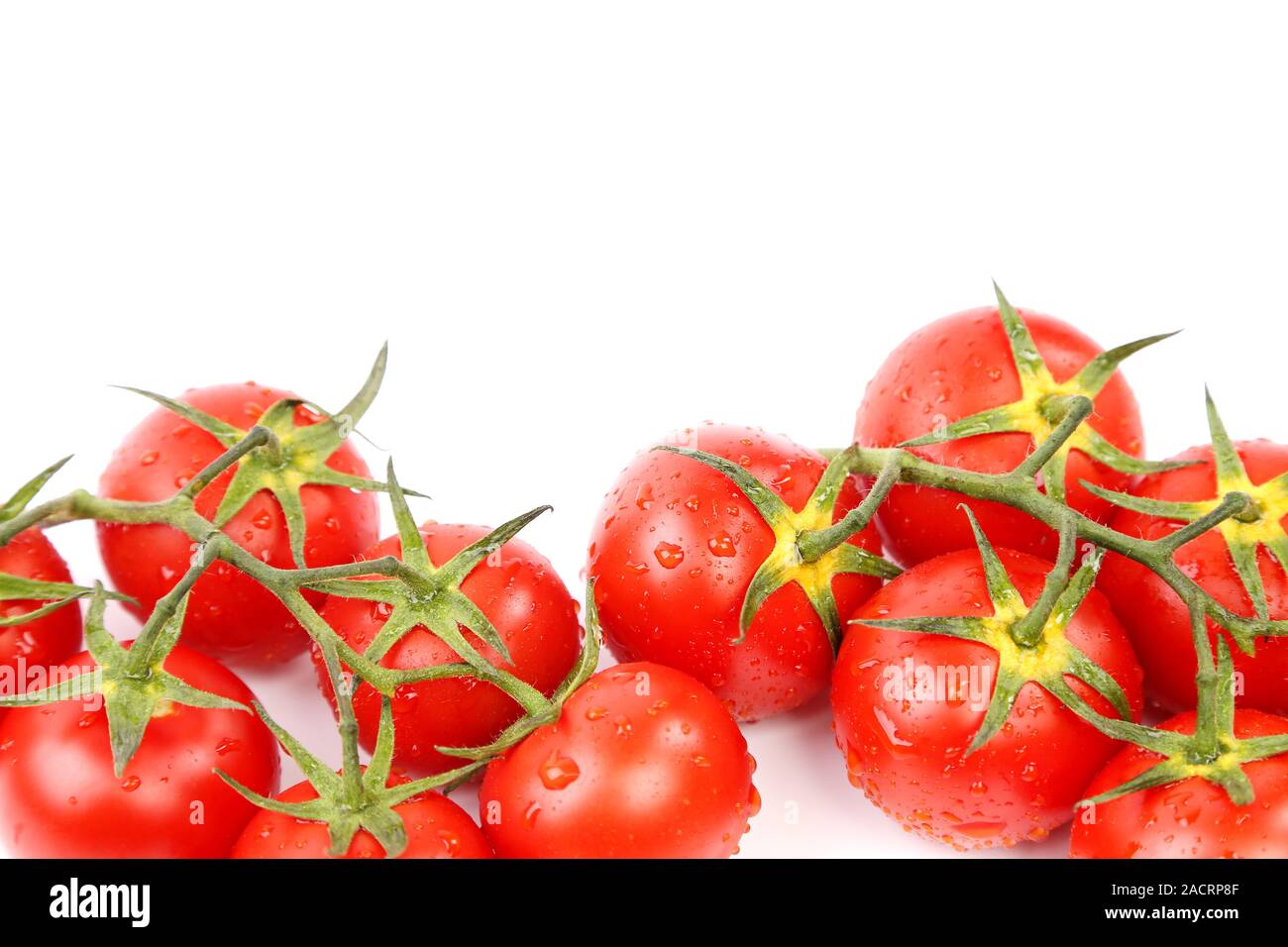 Two clusters of small red tomatoes Stock Photo - Alamy