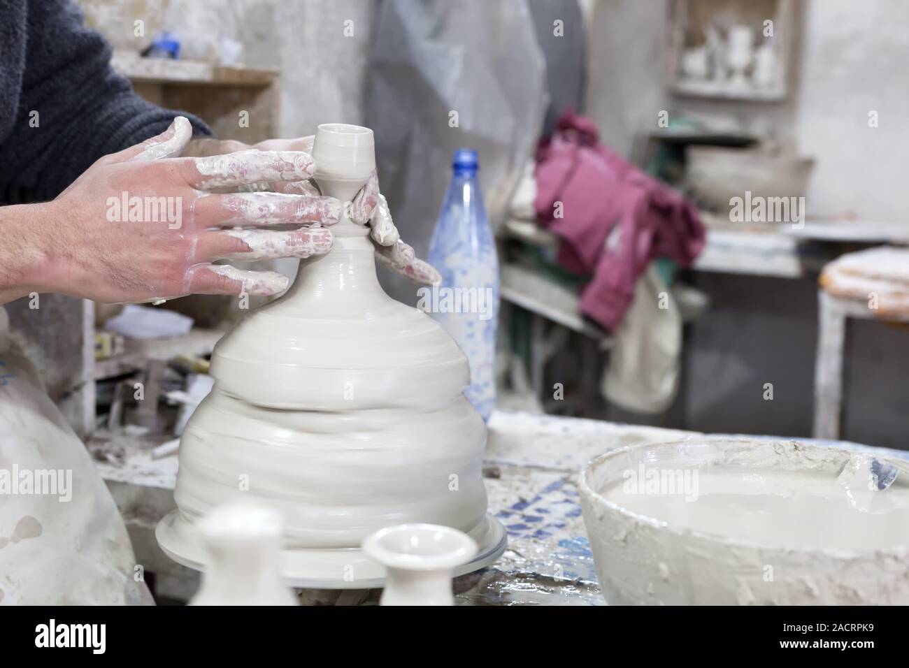 Potter at work in a pottery Stock Photo - Alamy