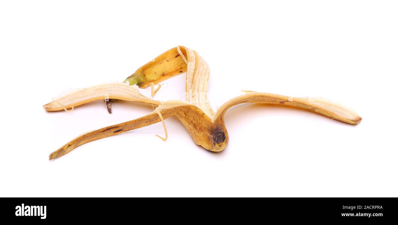 old banana peel on white background Stock Photo - Alamy