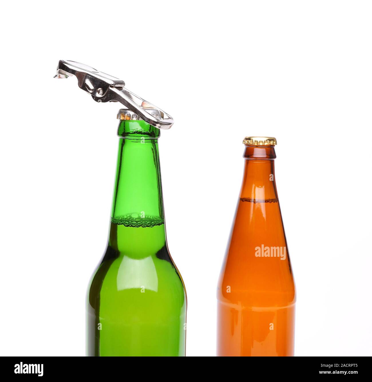 Two bottles of beer and a opener Stock Photo - Alamy