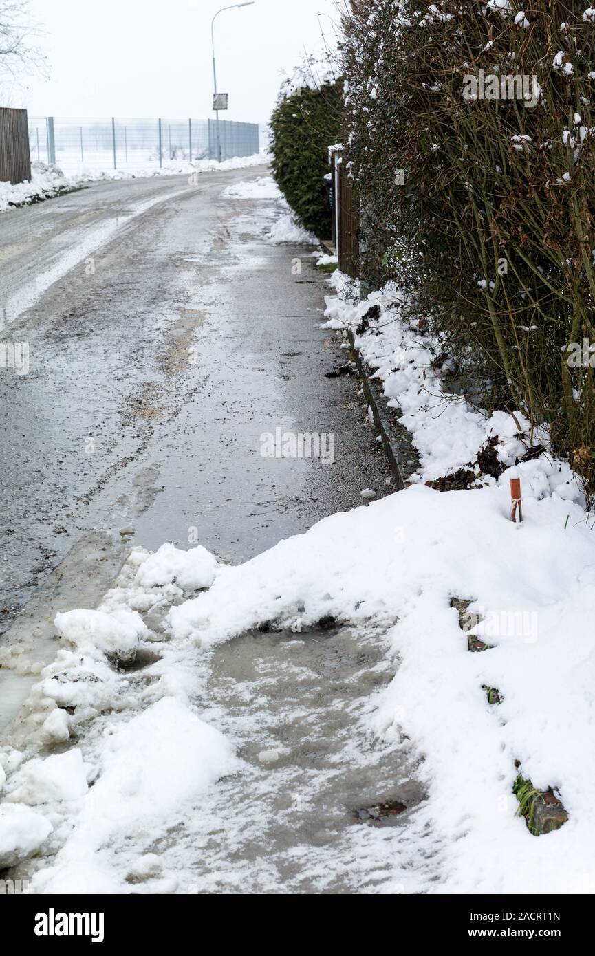 Snow on sidewalk Stock Photo - Alamy