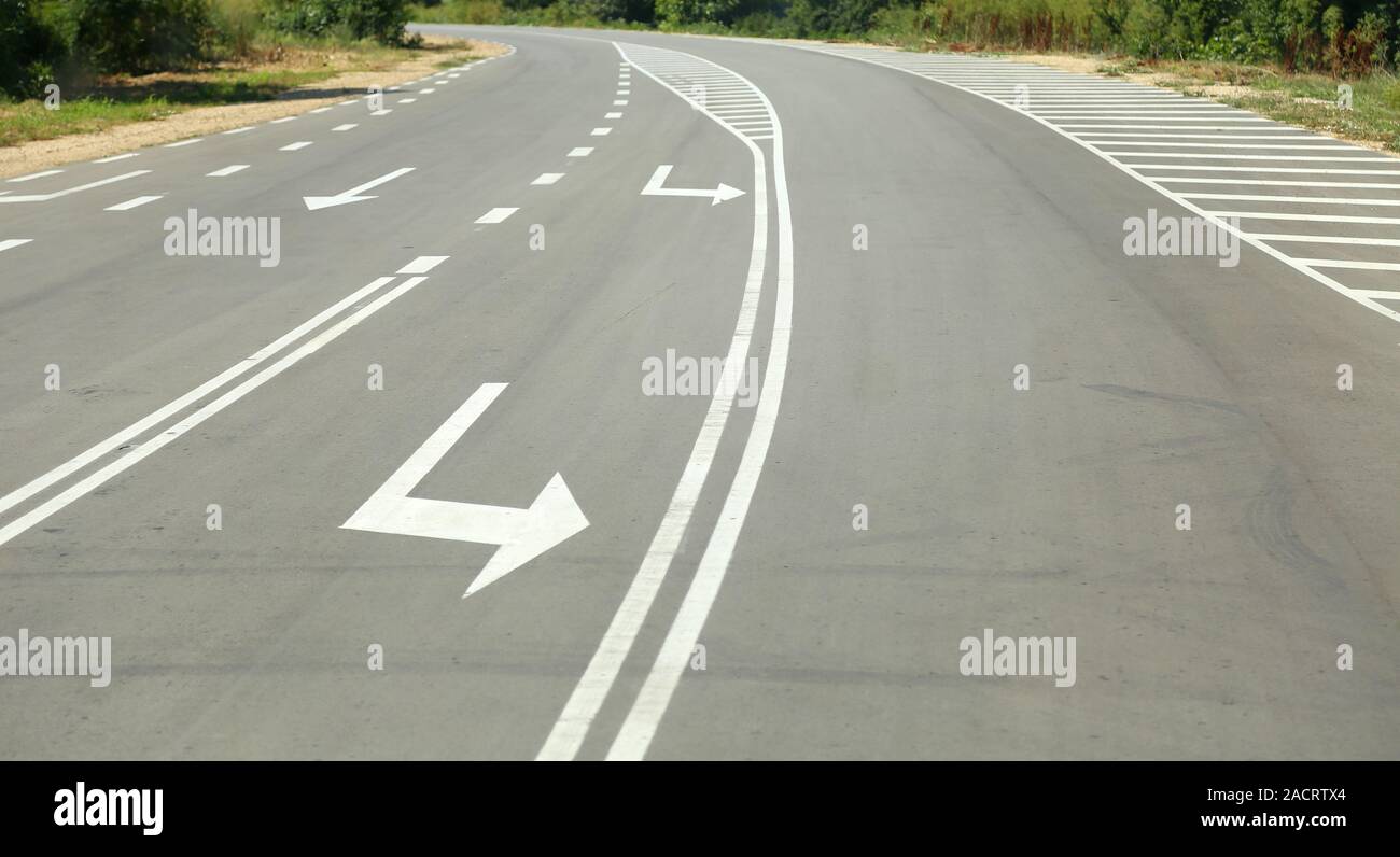 Arrow signs as road markings on suburban driveway Stock Photo - Alamy