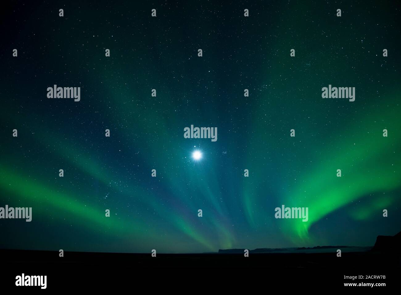 Northern lights, or Aurora Borealis, and a full Moon. Auroral displays ...