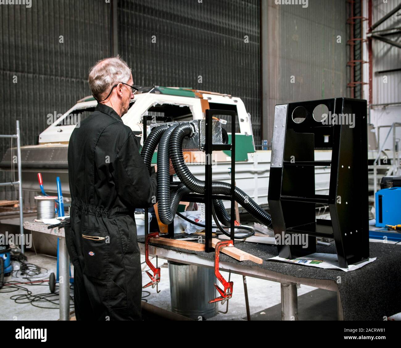 Hovercraft assembly. Engineer working on assembling parts for a ...