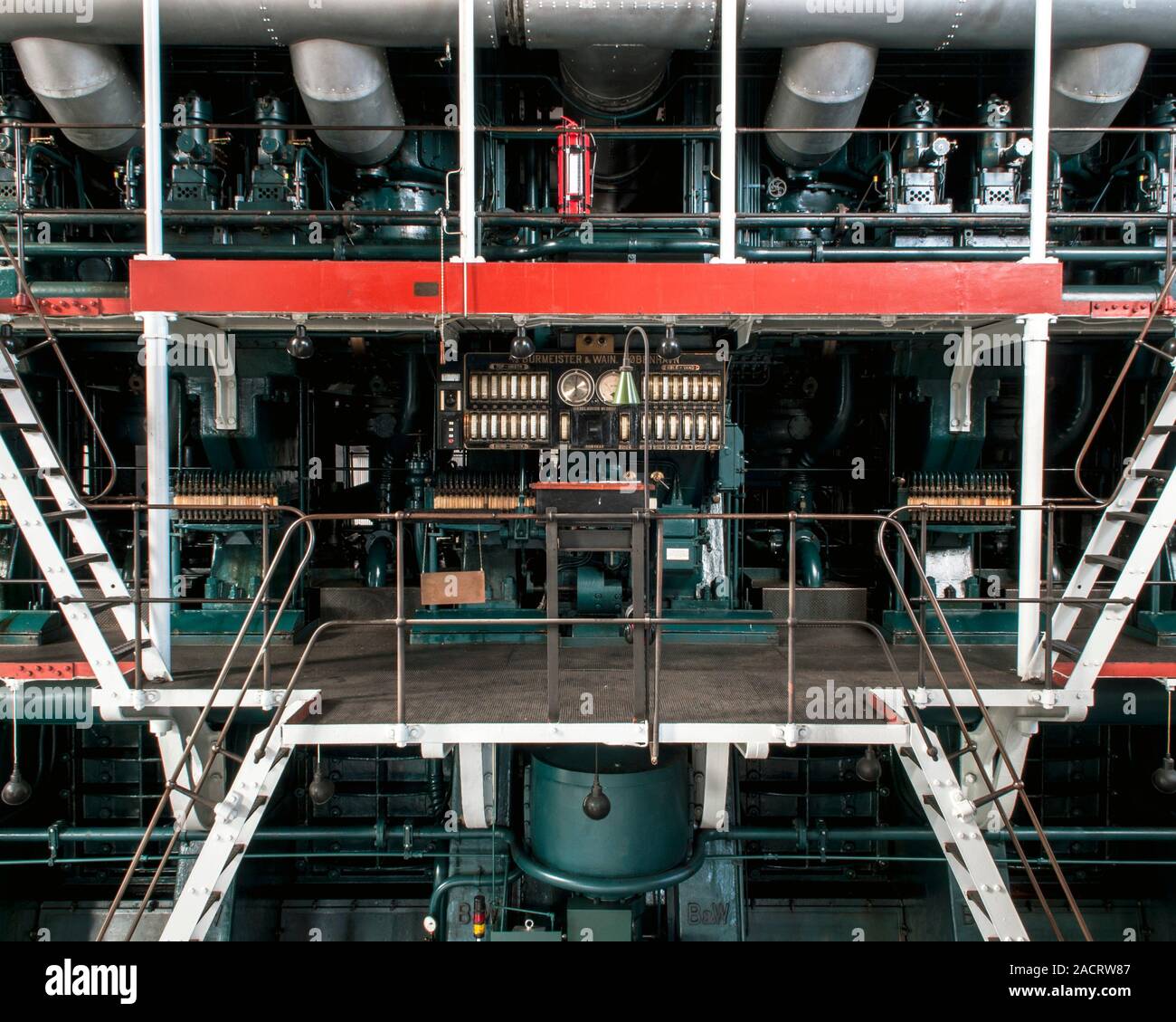 Diesel motor and housing at a power station. The motor (centre) is from ...
