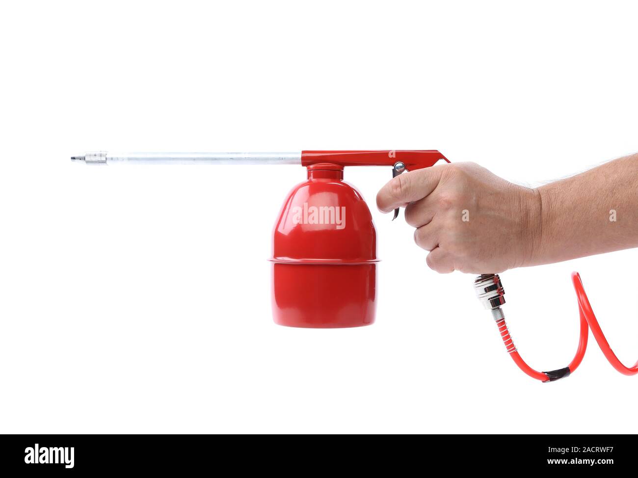 Spray gun and hand isolated Stock Photo - Alamy