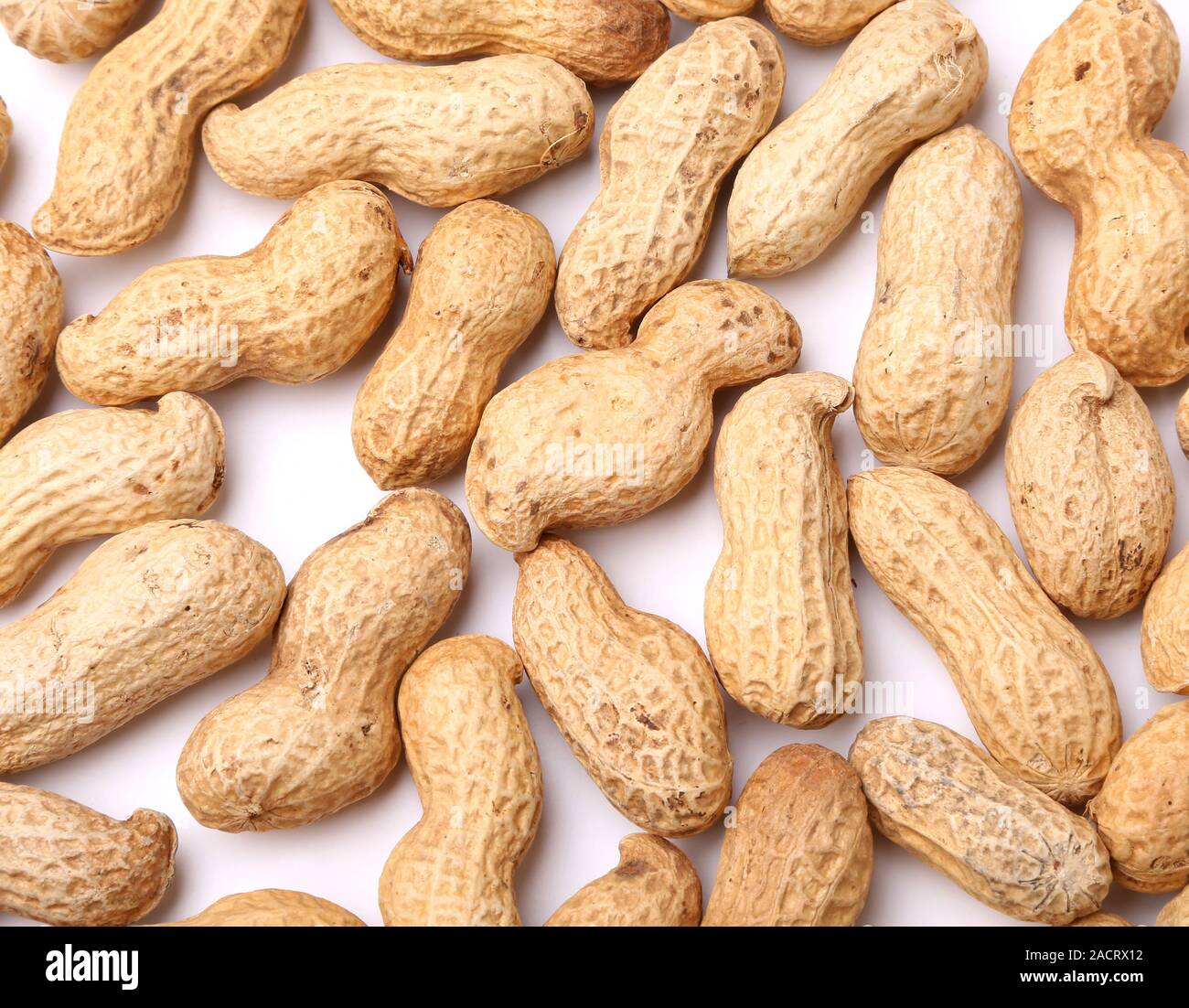 background from the raw peanuts scattered on white Stock Photo - Alamy