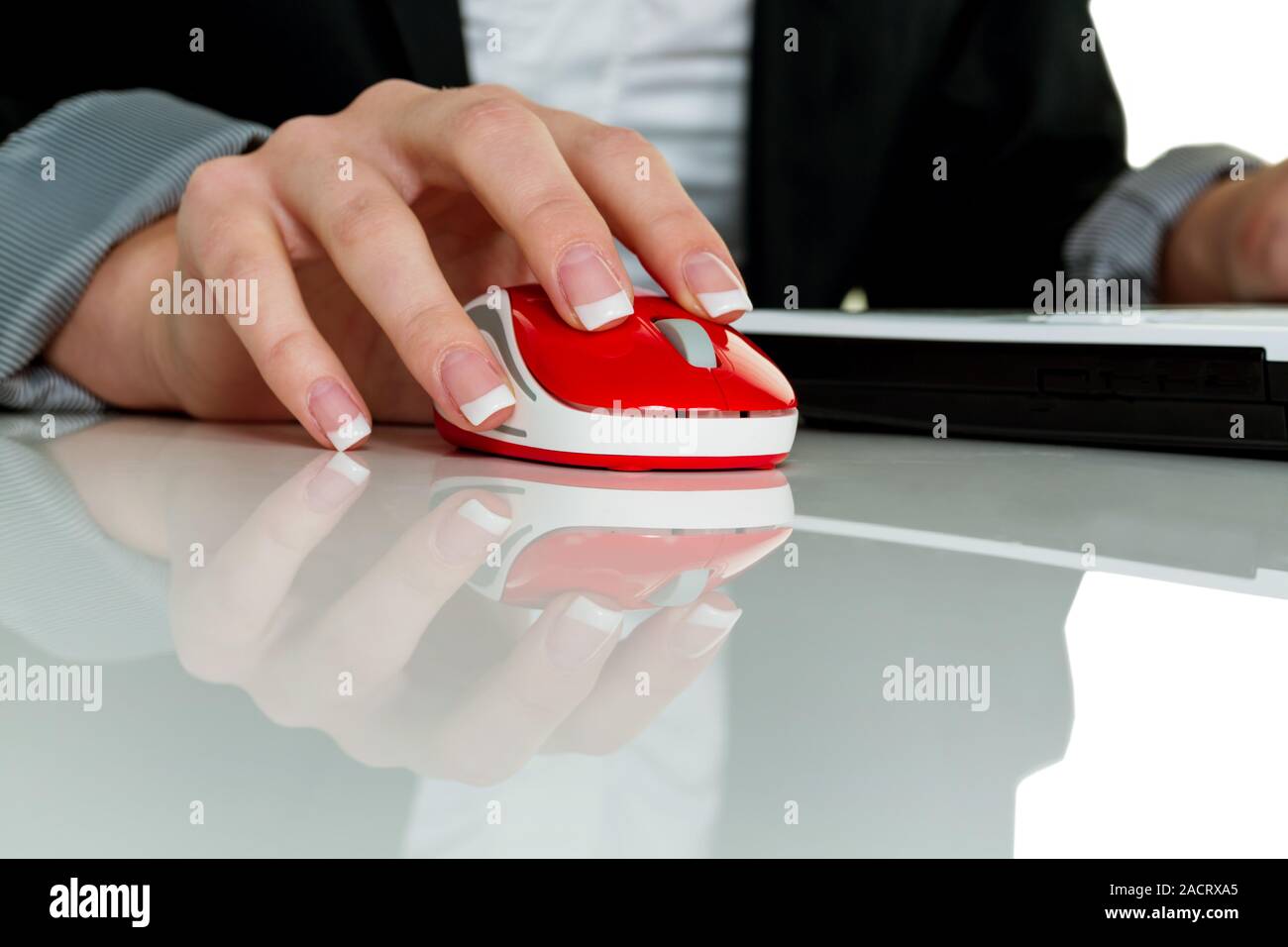 Woman in office with computer mouse Stock Photo - Alamy
