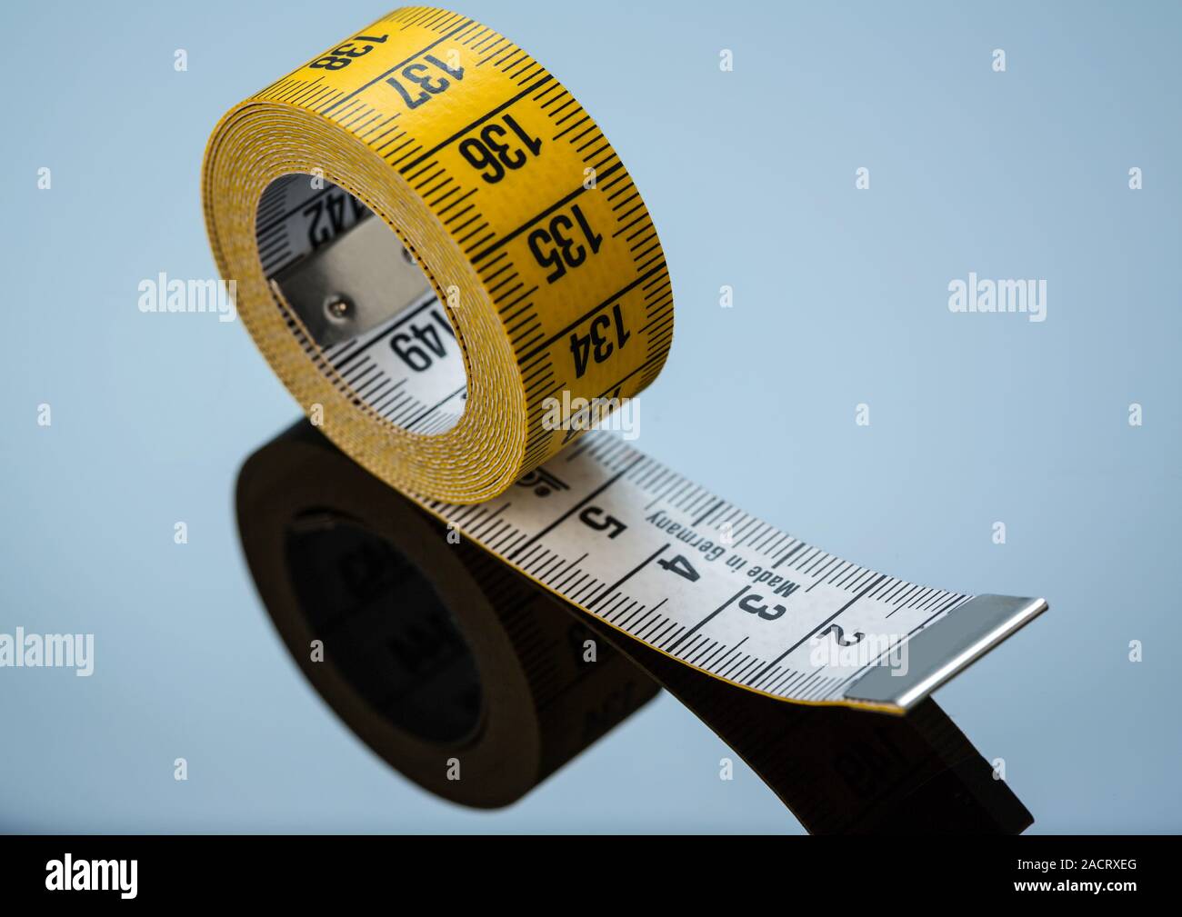 Yellow tape measure Stock Photo - Alamy