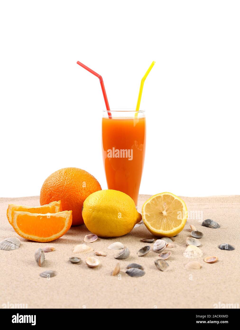Juice, orange, lime, shells on sand Stock Photo - Alamy
