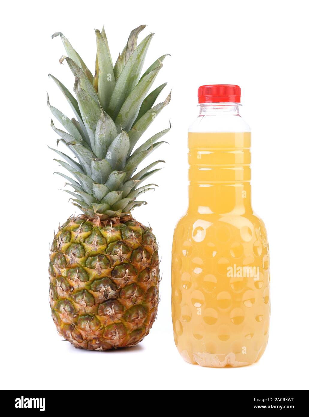 Pineapple and bottle of juice Stock Photo - Alamy