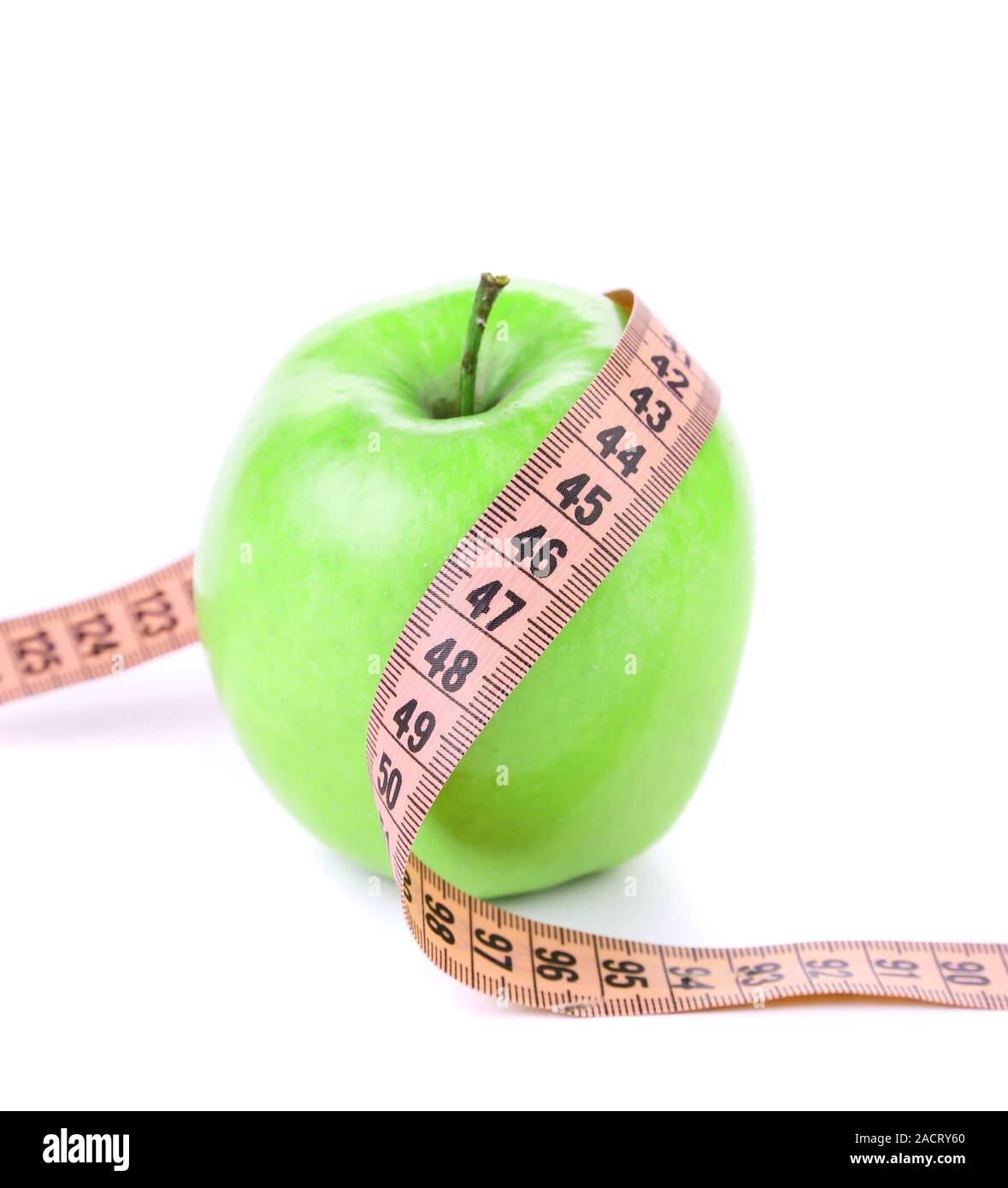 Green apple with measuring tape Stock Photo - Alamy