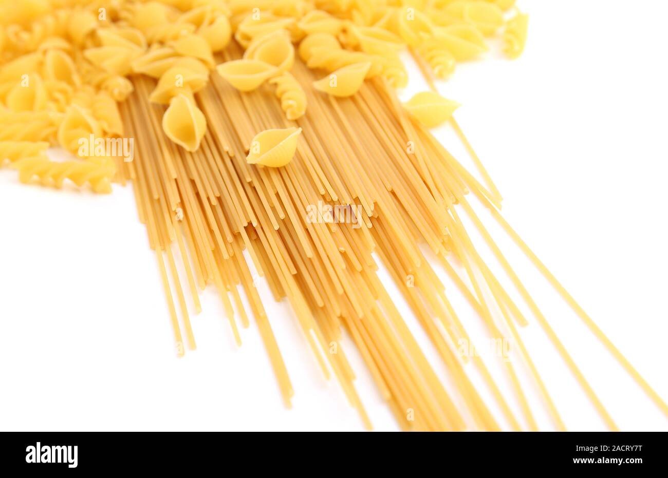 Yellow Italian pasta in different forms Stock Photo - Alamy