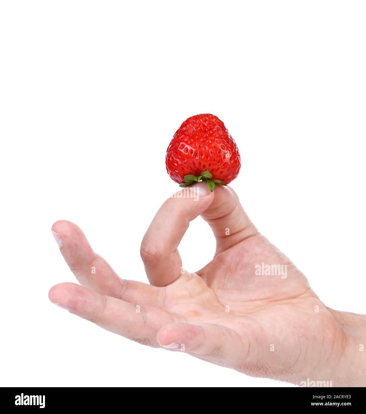 Hand holding a strawberry Stock Photo - Alamy
