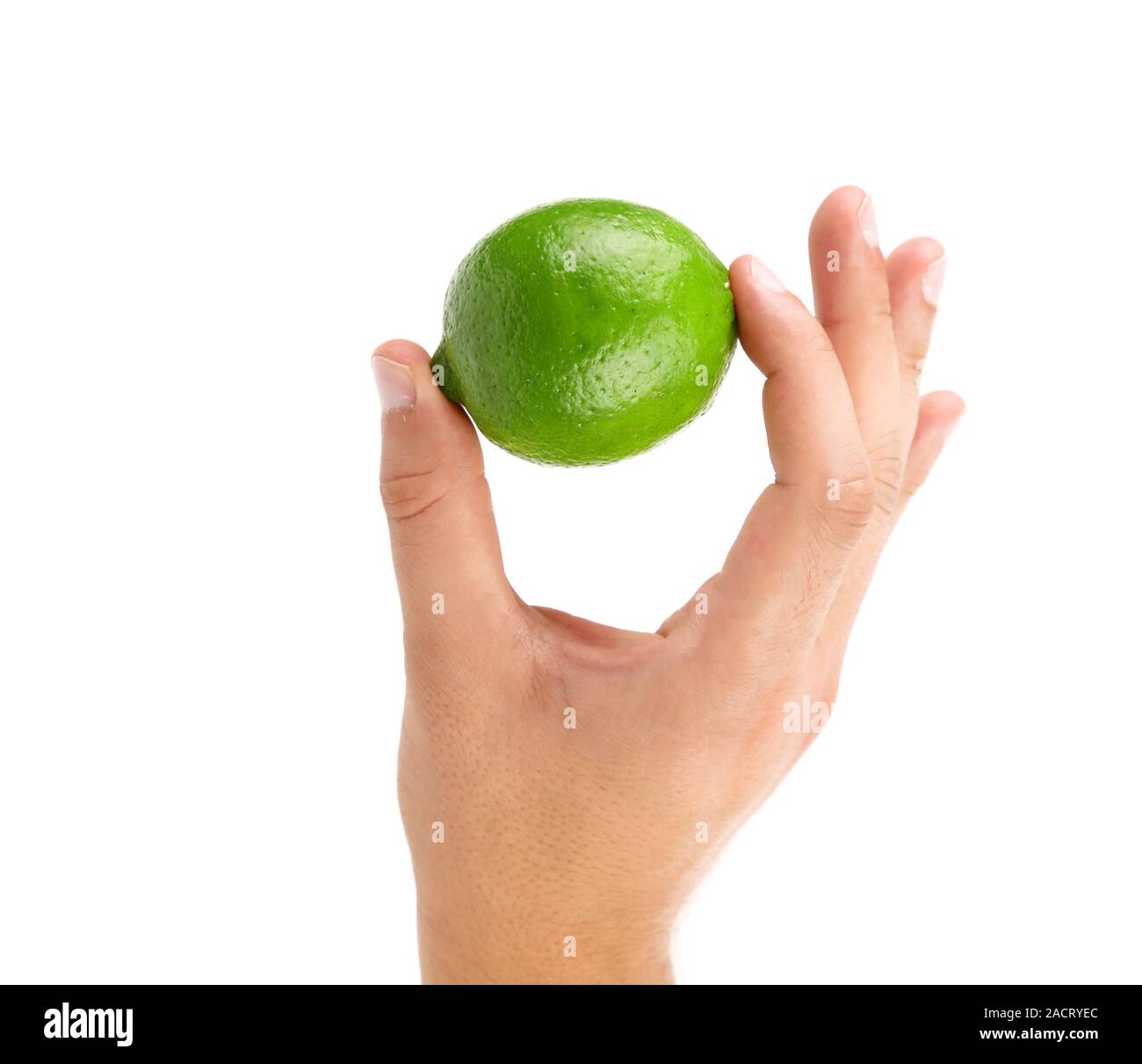 lime in hand on a white background Stock Photo - Alamy