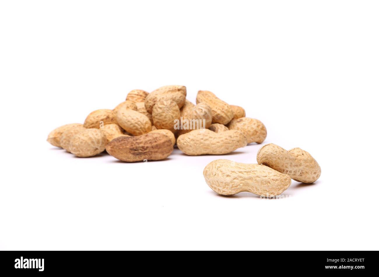 Two peanuts in closeup on the peanut background Stock Photo - Alamy