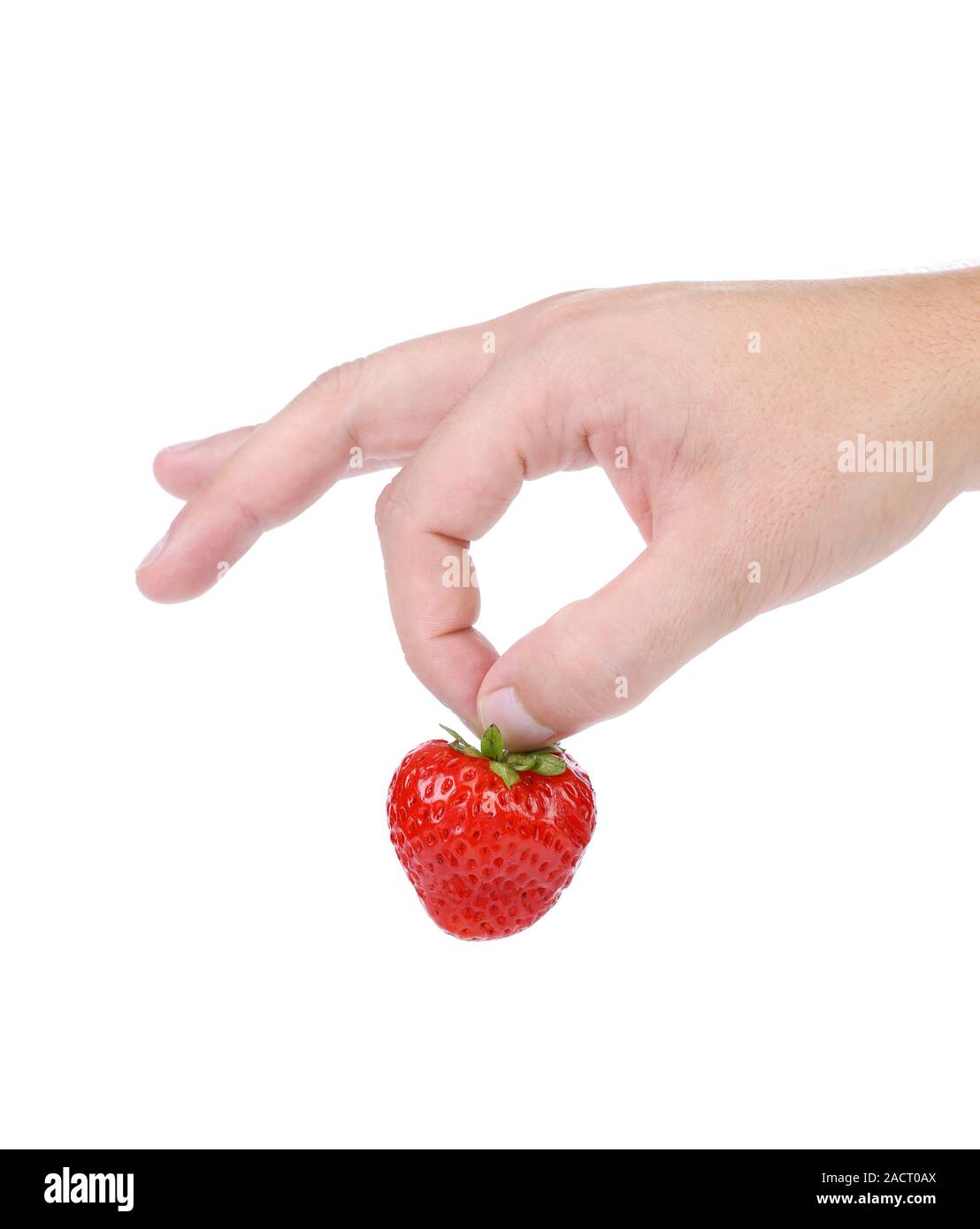 Hand holding a strawberry Stock Photo - Alamy