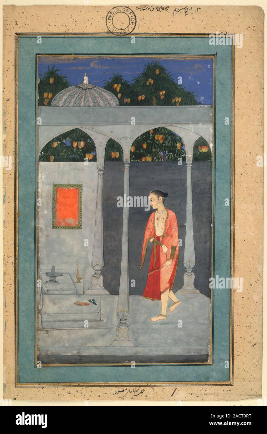 A Hindu lady visits a Shaivite lingam shrine at night, approaching from ...