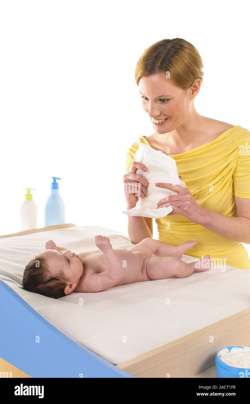 Changing baby hi-res stock photography and images - Alamy