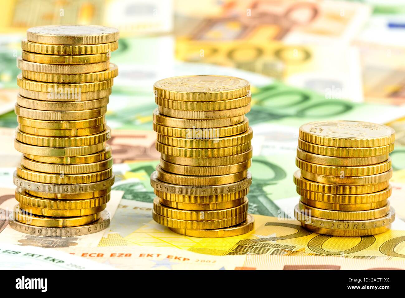 Stack of money coins, sinking curve Stock Photo - Alamy