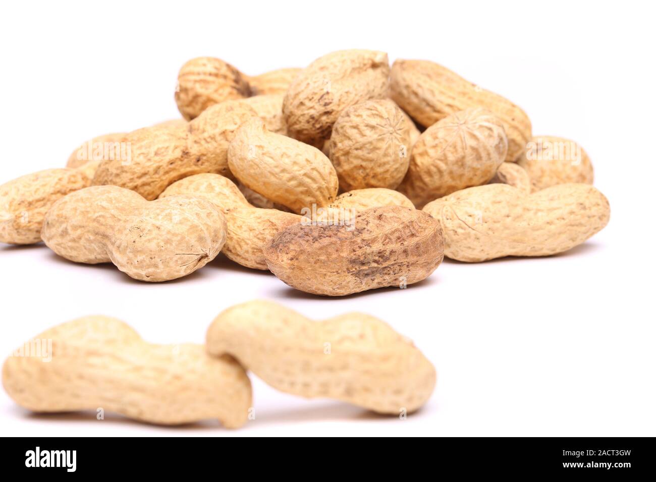 Two peanuts in closeup on the peanut background Stock Photo - Alamy