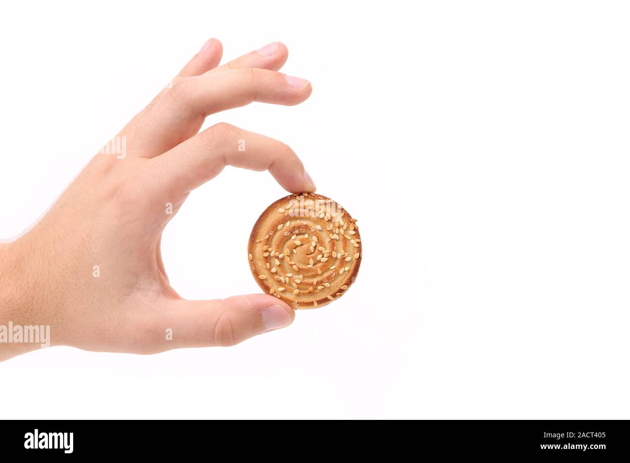 Closeup hand eating cake Cut Out Stock Images & Pictures - Alamy