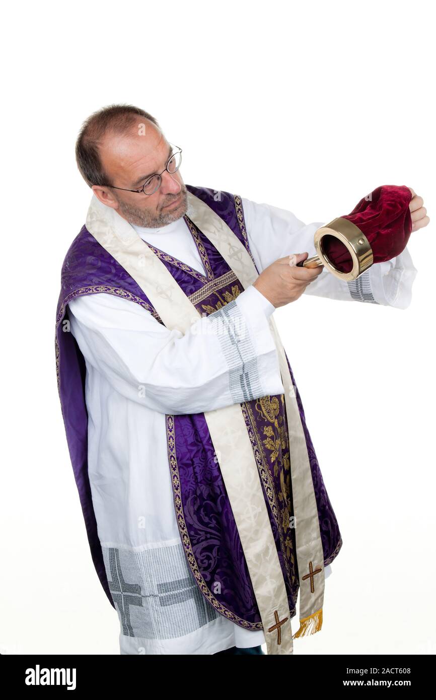Catholic priest collects money Stock Photo - Alamy