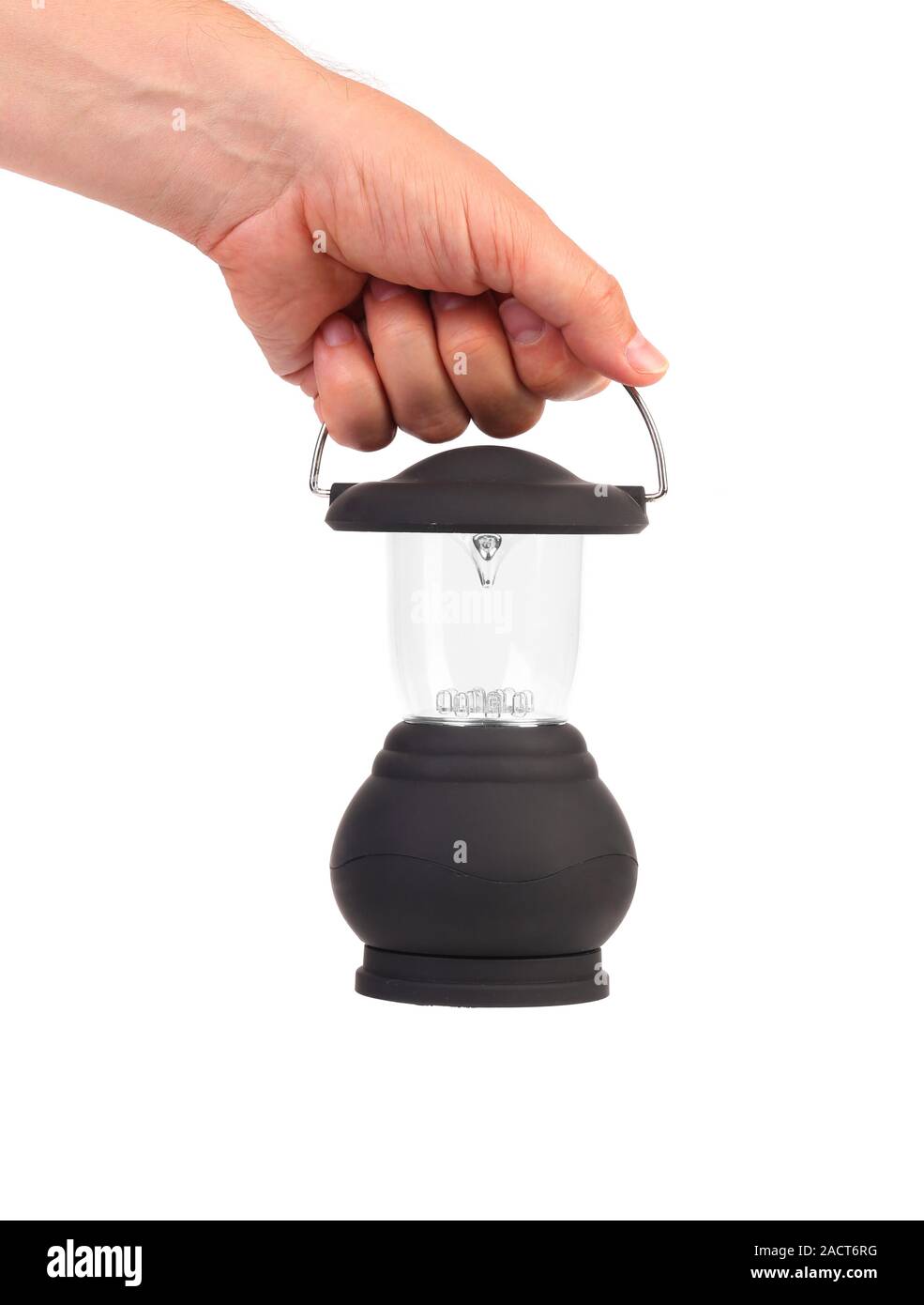Hand holds camping lantern isolated on white Stock Photo - Alamy