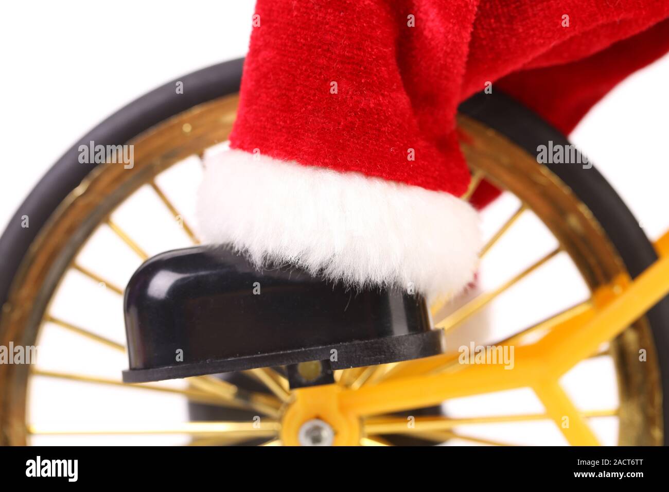 Wheel of bicycle, black boot and red leg Stock Photo - Alamy