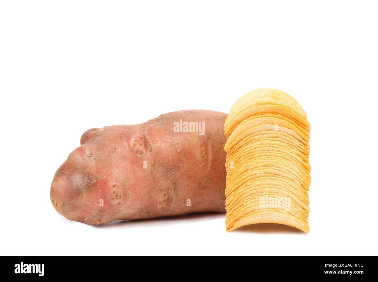 Tuber of potato and stack chips Stock Photo - Alamy