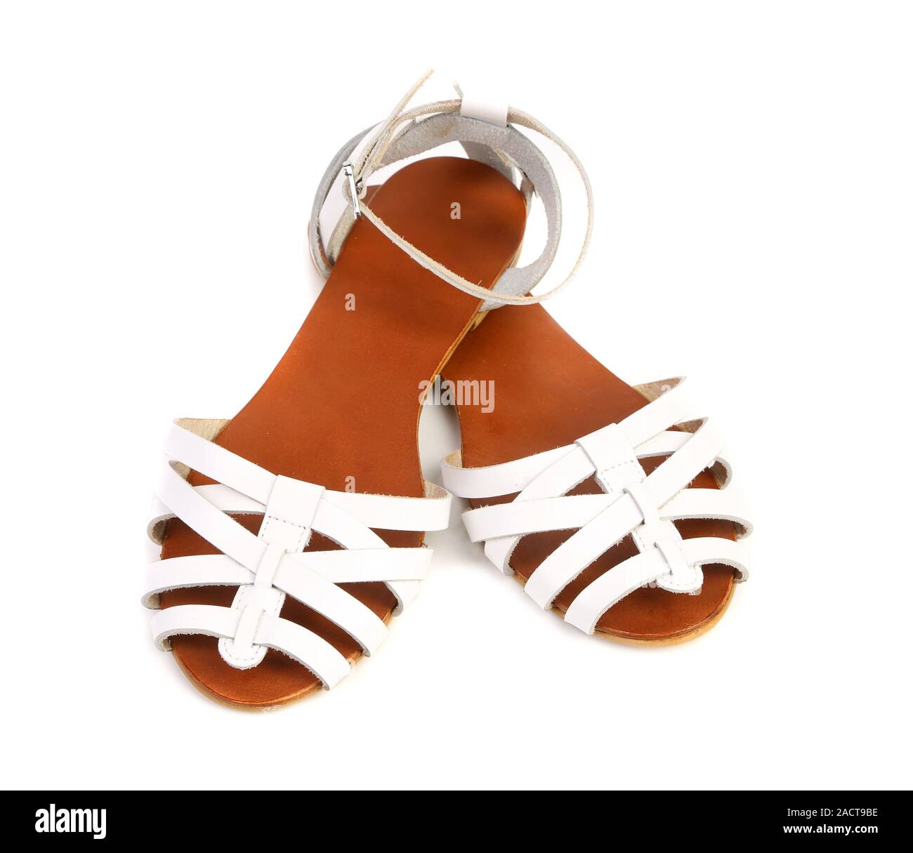 Pair of white leather female sandals Stock Photo - Alamy