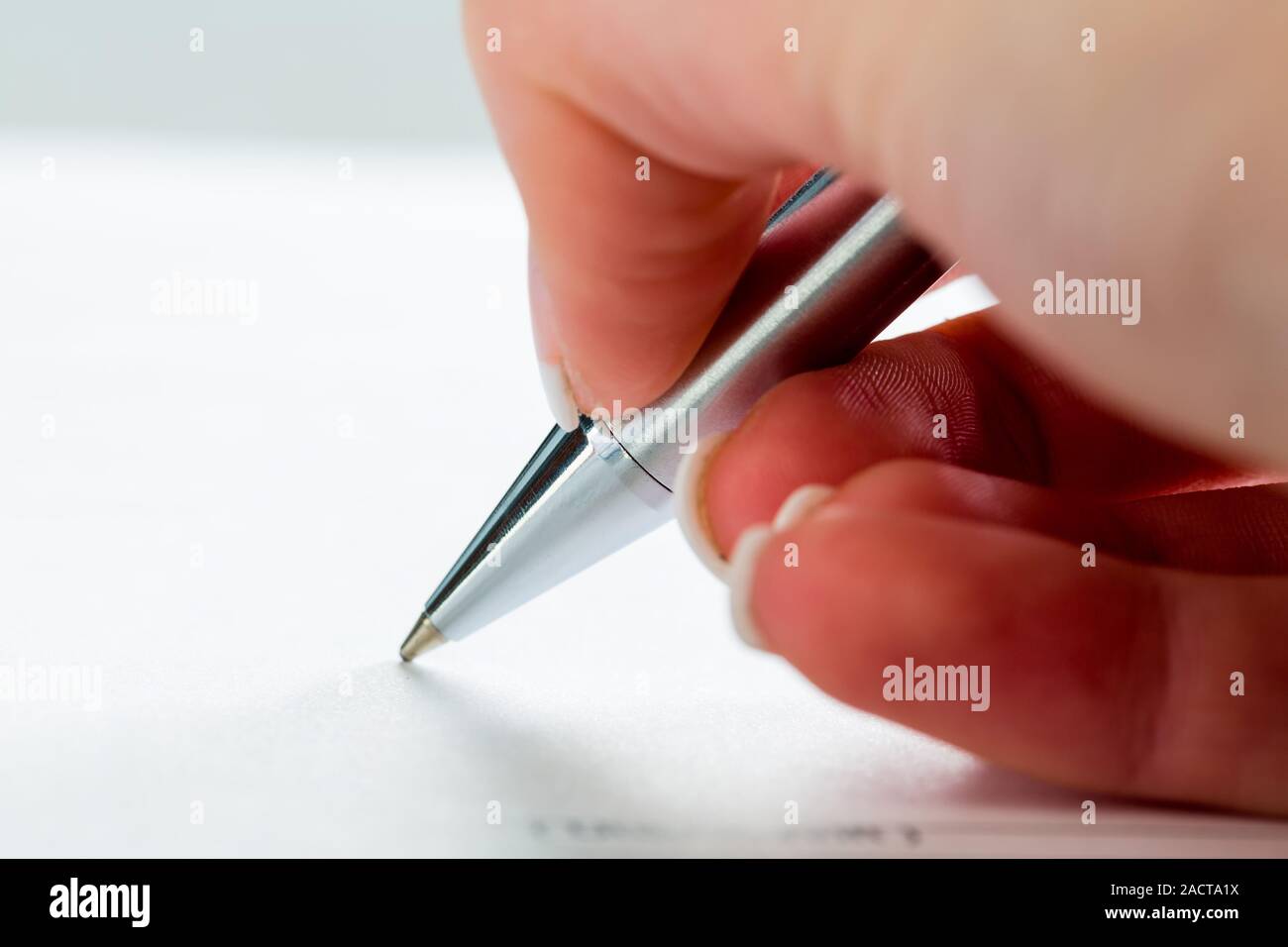 Hand with fountain pen for signature Stock Photo - Alamy