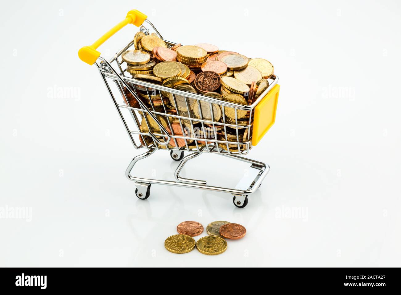 Coins in shopping cart Stock Photo - Alamy