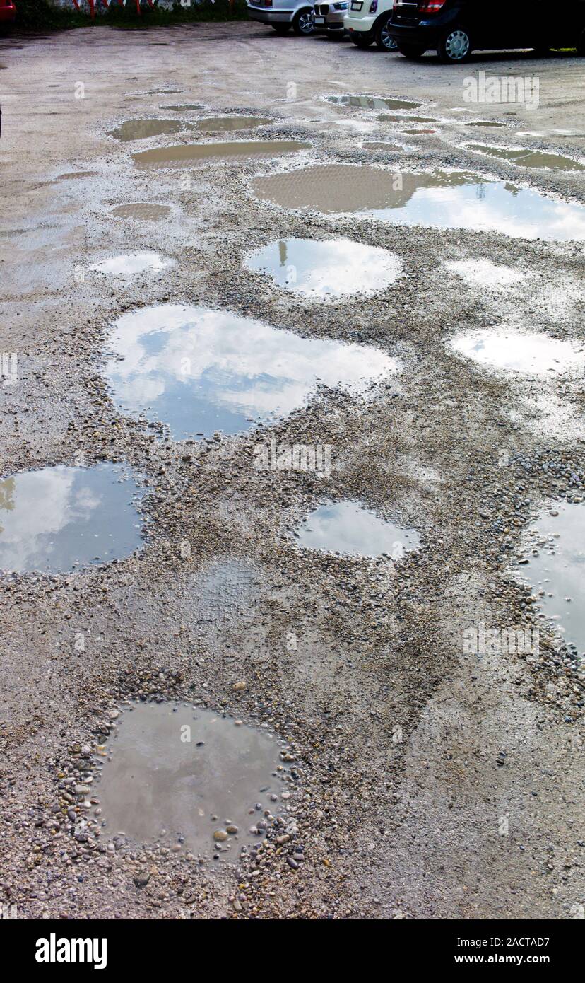 Puddles on a parking lot Stock Photo - Alamy