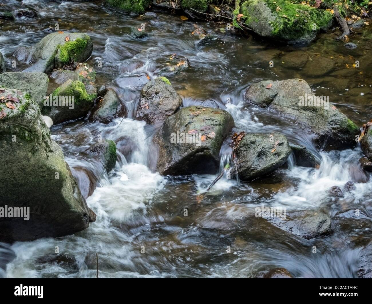 Stream with running water Stock Photo - Alamy