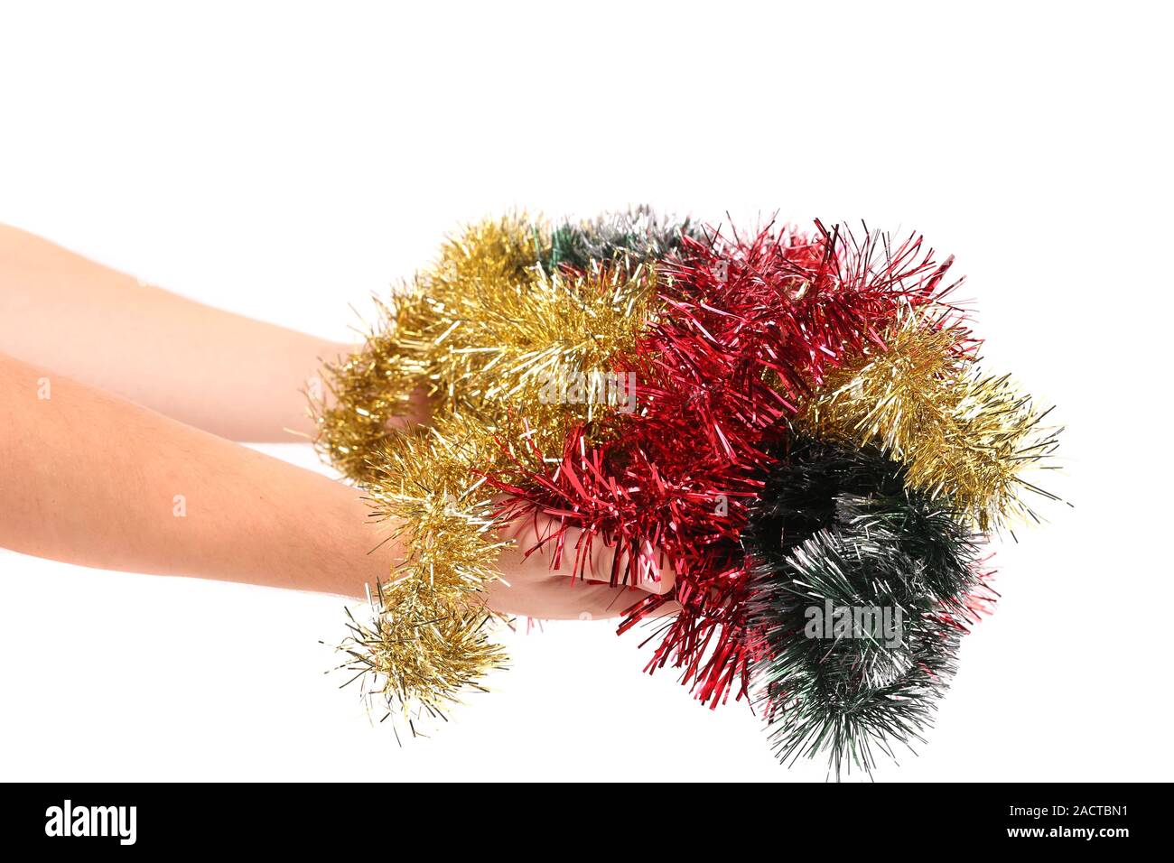 Different color tinsel on hand Stock Photo - Alamy