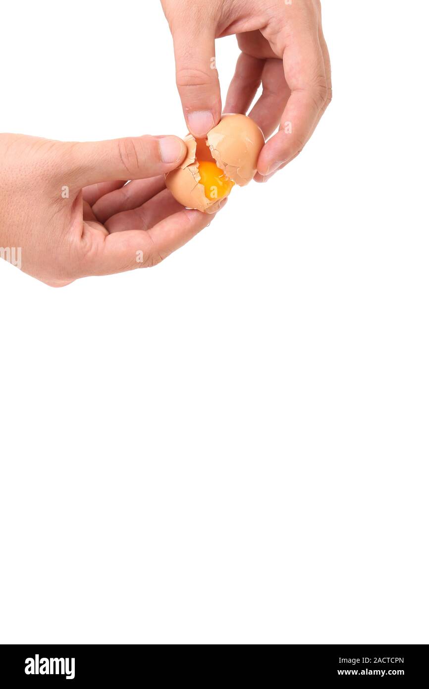 Hands breaking of eggs Stock Photo - Alamy