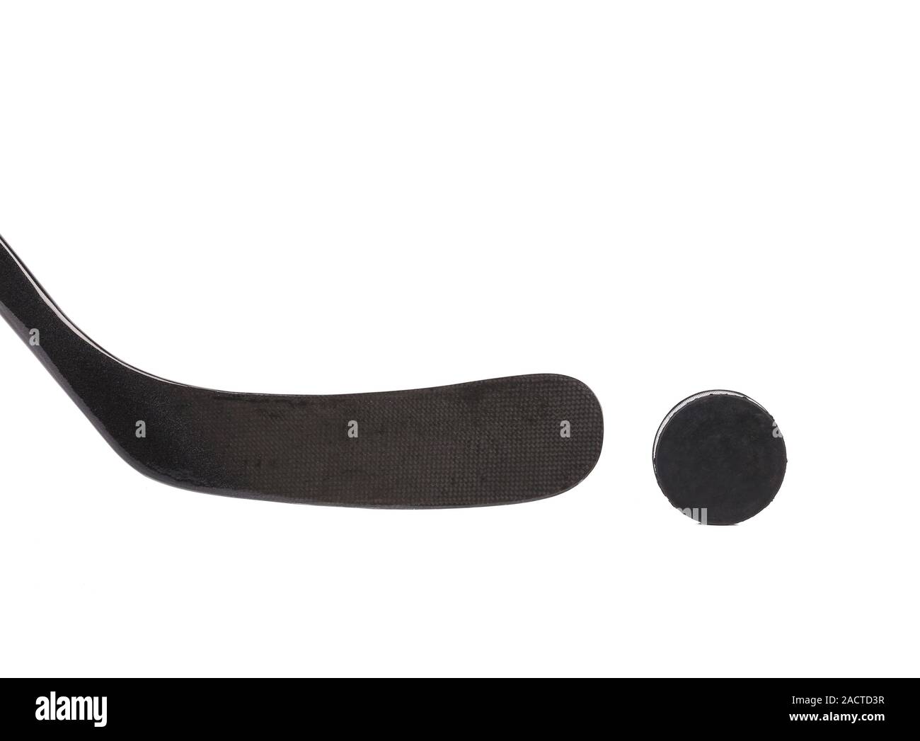 Black ice hockey stick and puck Stock Photo - Alamy