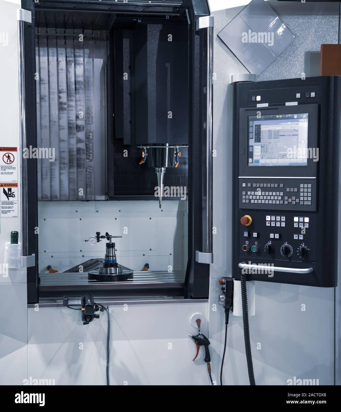 Modern industrial production CNC vertical machining center Stock Photo ...