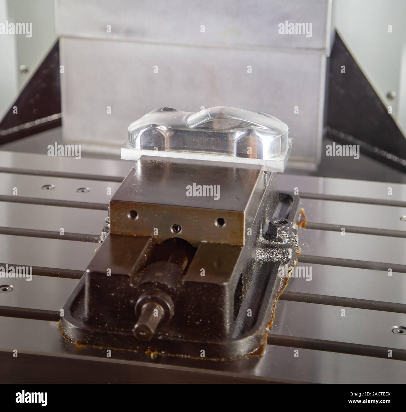 CNC milling machine. Cutting workpiece sport car, industrial machining ...