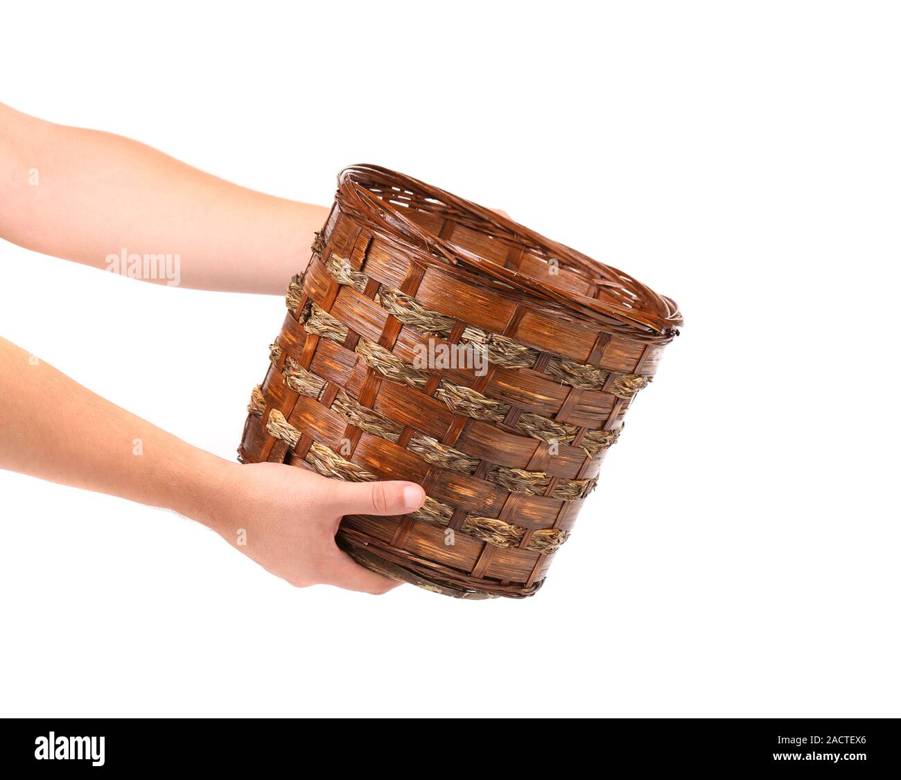 Hand holds basket Stock Photo - Alamy
