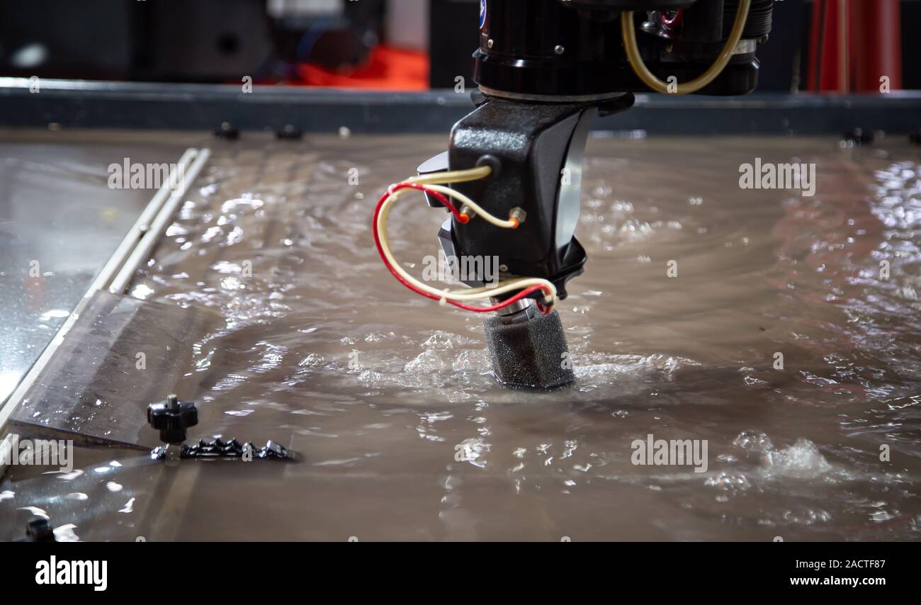 Modern industry CNC abrasive water jet cutting machine Stock Photo - Alamy