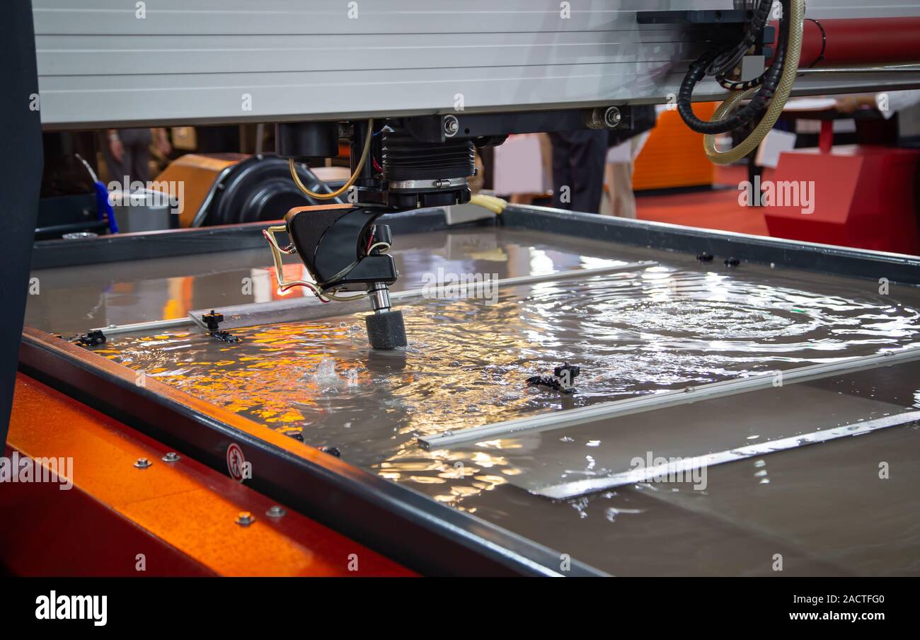 Modern industry CNC abrasive water jet cutting machine Stock Photo - Alamy