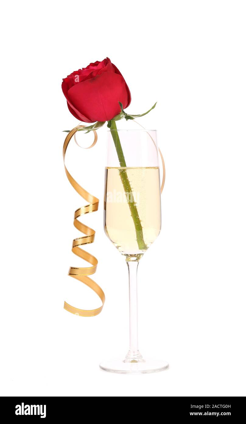 Red rose in glass of champagne and paper streamer Stock Photo - Alamy