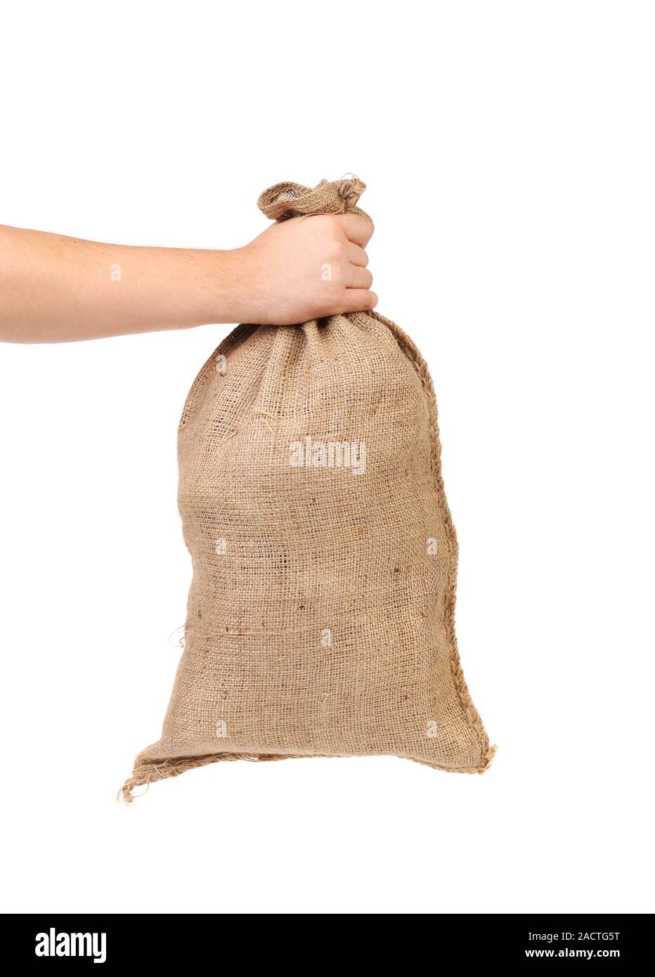 Hand holding full sack Stock Photo - Alamy