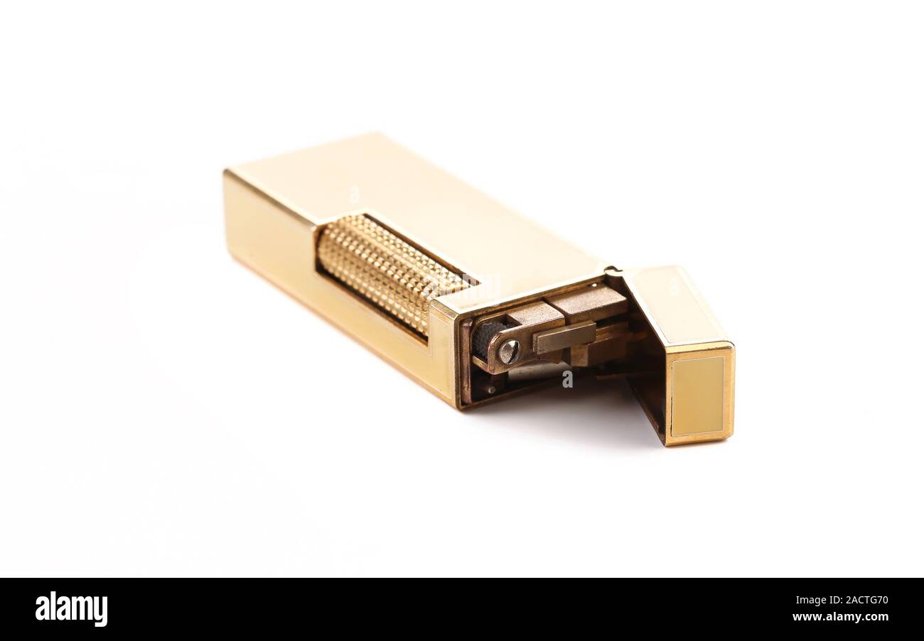 Elegant golden gas lighter Stock Photo - Alamy