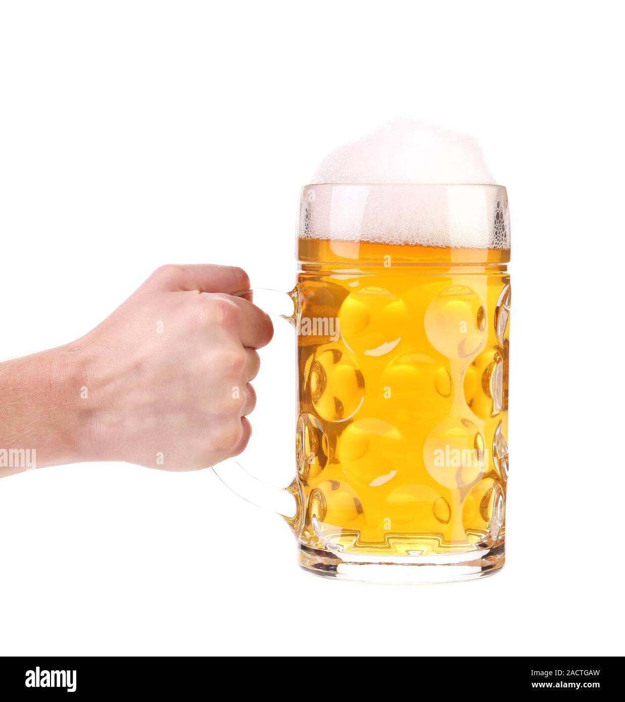 Hand holds mug of beer with foam Stock Photo - Alamy