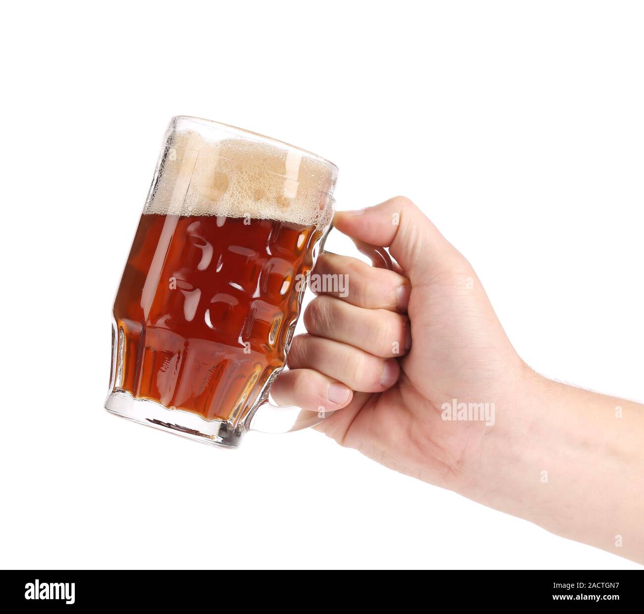 Mug in hand with brown beer Stock Photo - Alamy