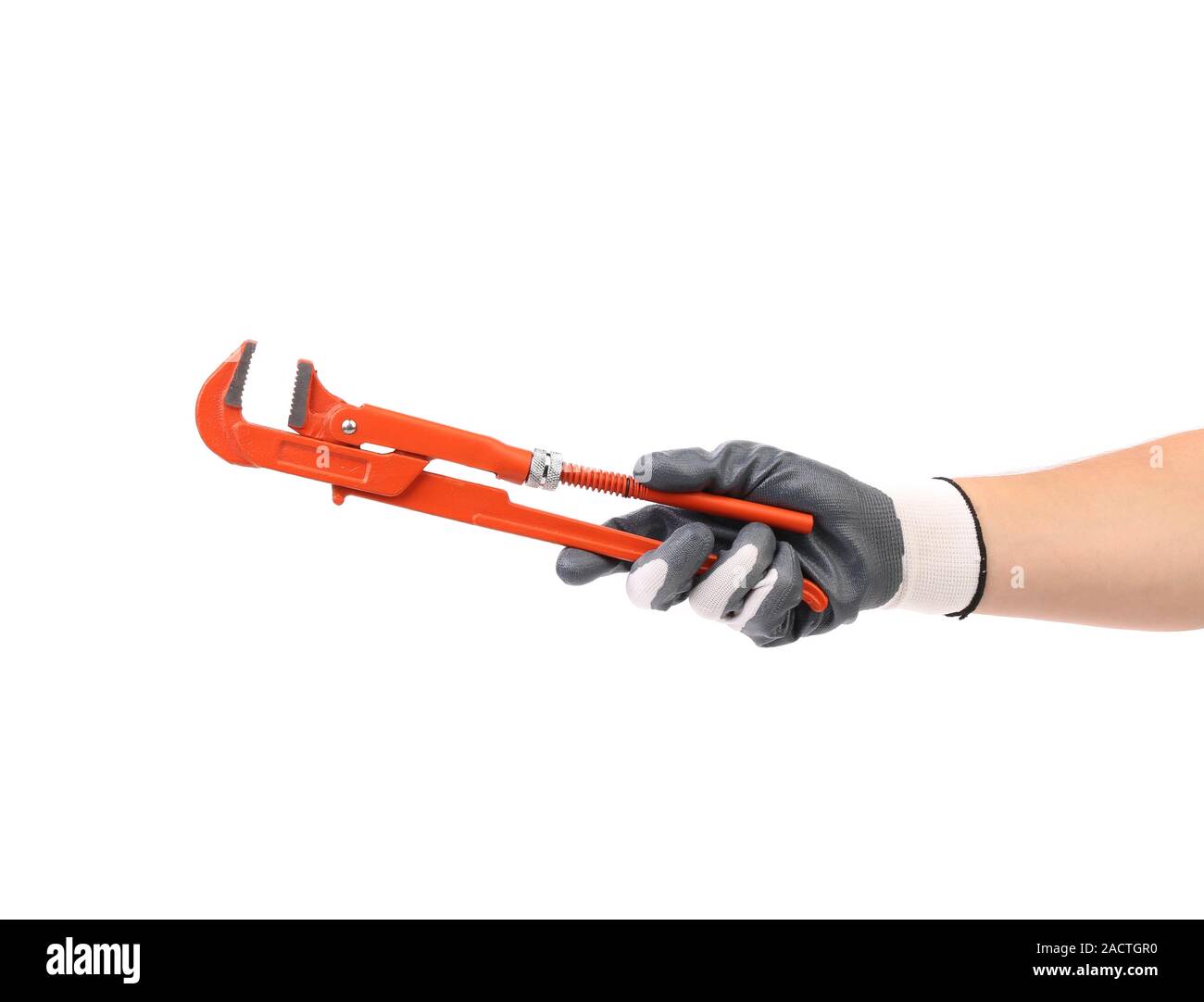 Hand in glove holding wrench Stock Photo - Alamy